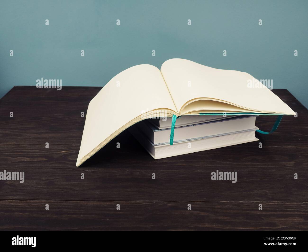 Open book on blue background, open pages as a concept of new knowledge ...