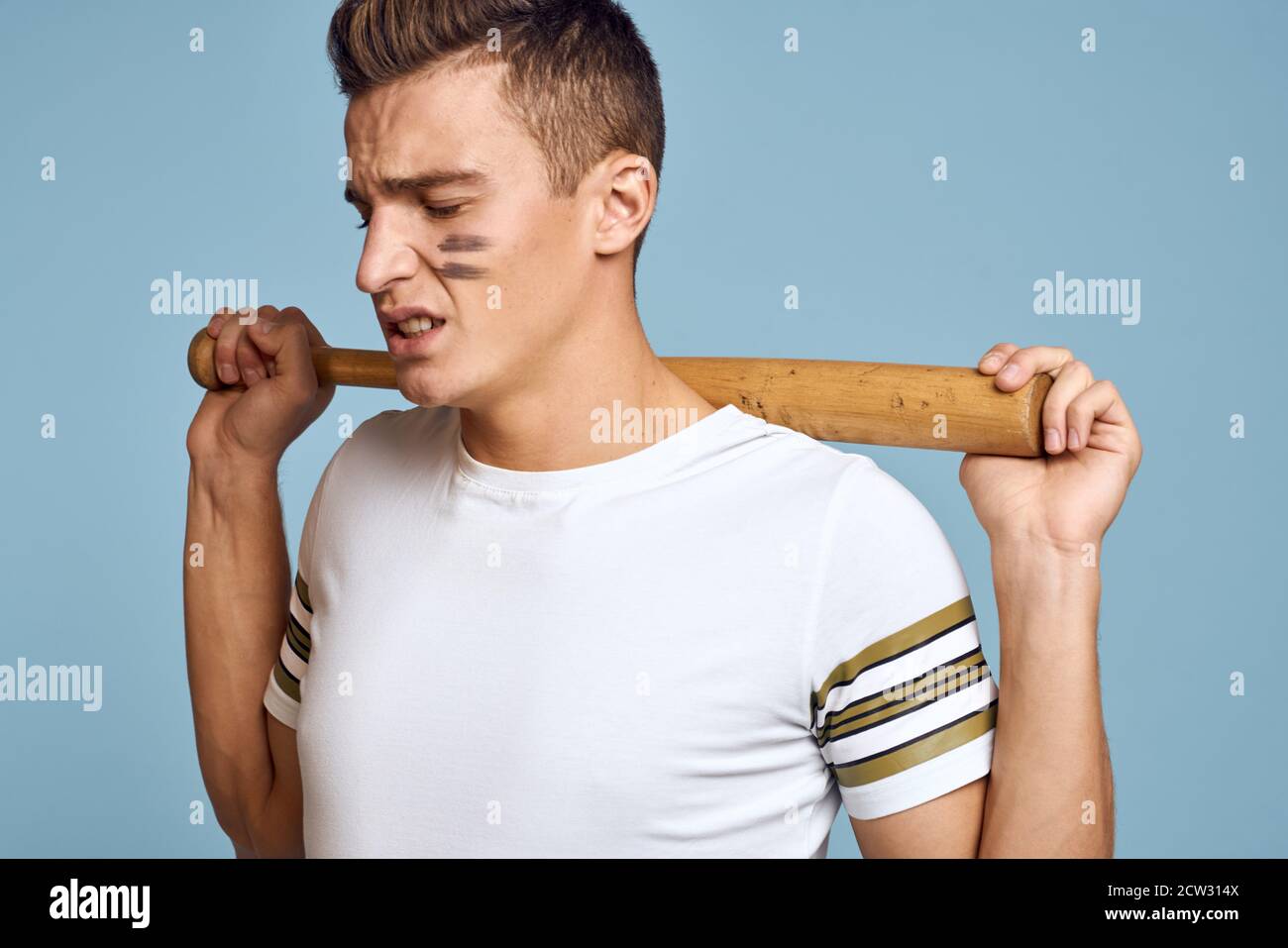 baseball guy with a bat in his hand on a blue background and a combat ...