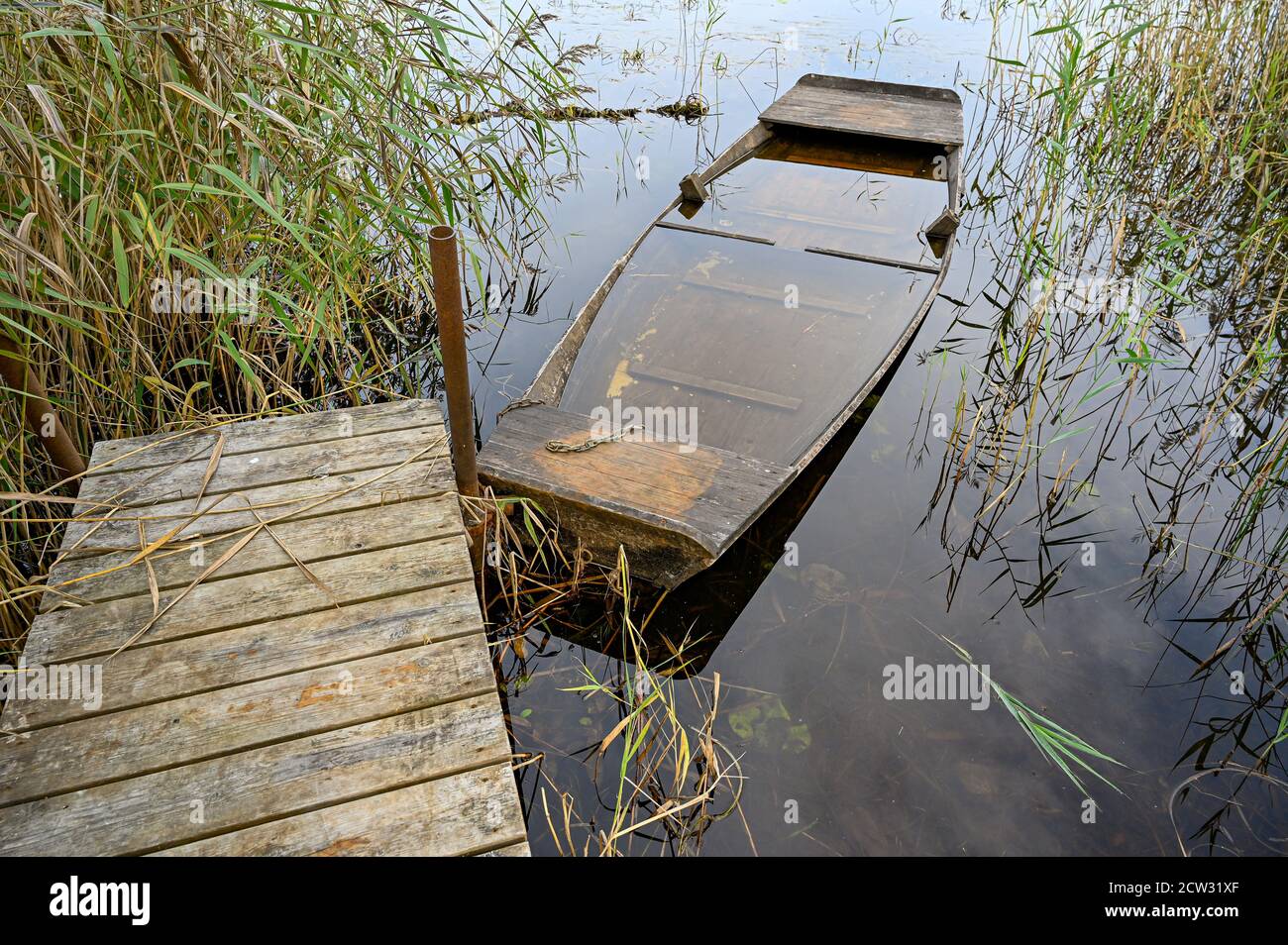 Old rowing boat filled with water hi-res stock photography and images ...