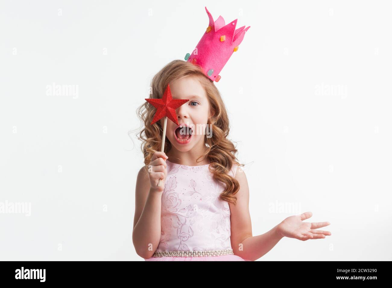 Beautiful little candy princess girl in crown holding star shaped magic ...