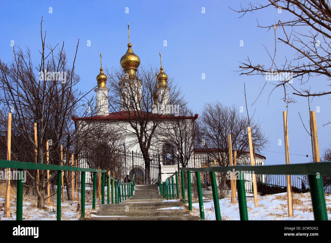 The road to the temple. Orthodox church with golden domes Stock Photo ...