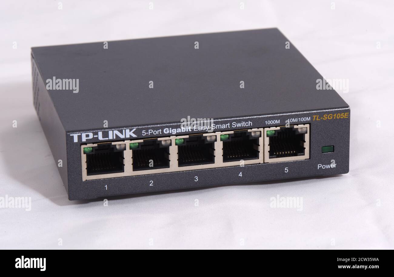 Five port small ethernet switch with RJ45 cable interface sockets Stock ...