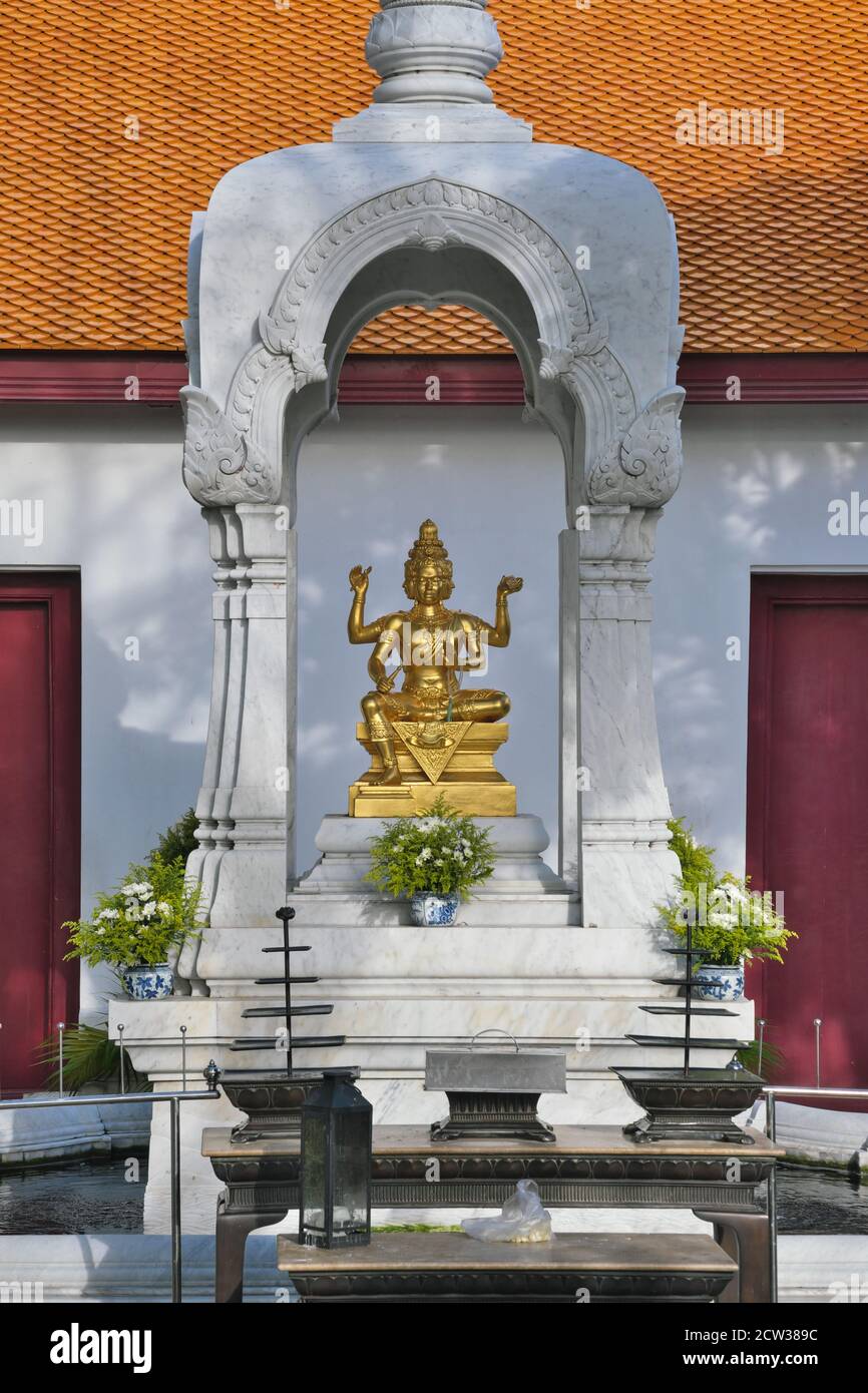 A four-headed statue of HIndu god Brahma in front of the Dhevasathan ...