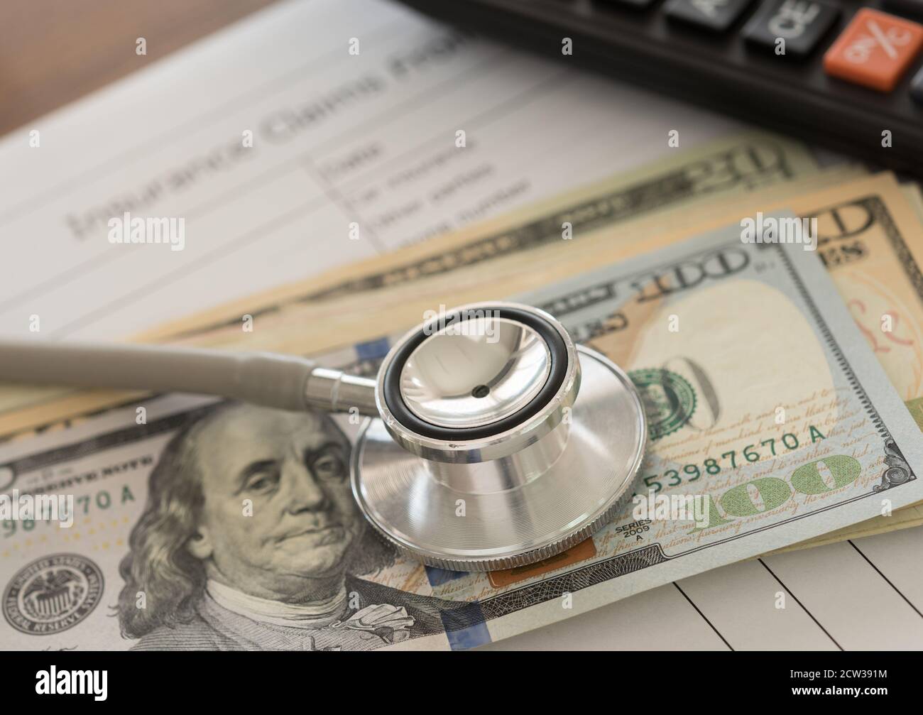 Health insurance claim concept. Stethoscope on dollar banknote with ...