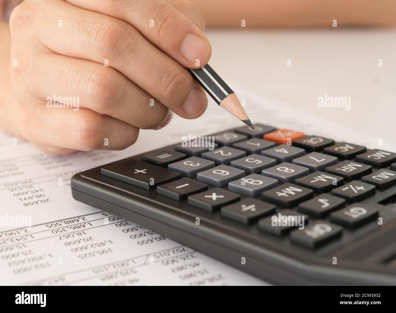 Accountant using a calculator to calculate the numbers. Concept of ...