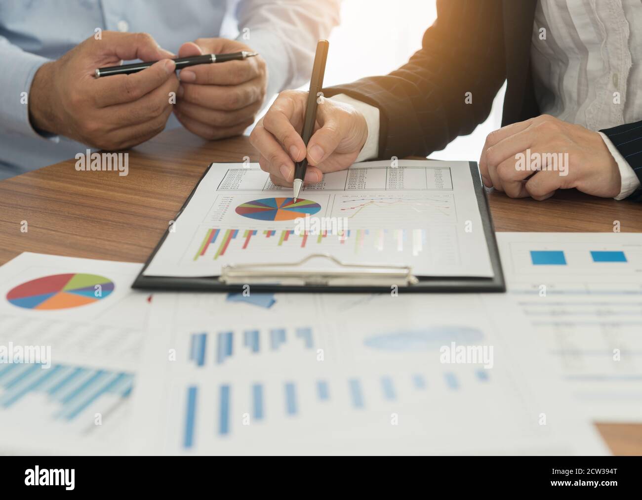 Financial advisor team are analyzing return on investment from business ...
