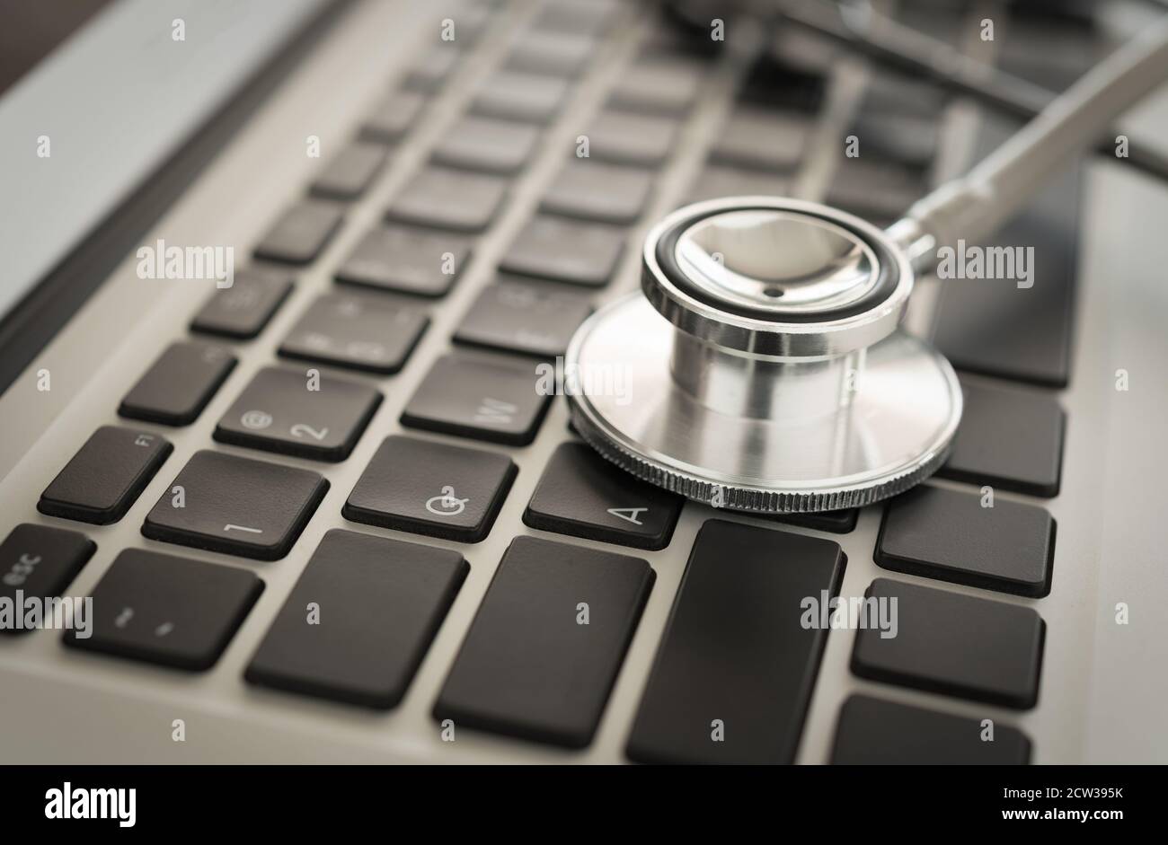 Stethoscope medical on laptop keyboard. antivirus protection or repair ...