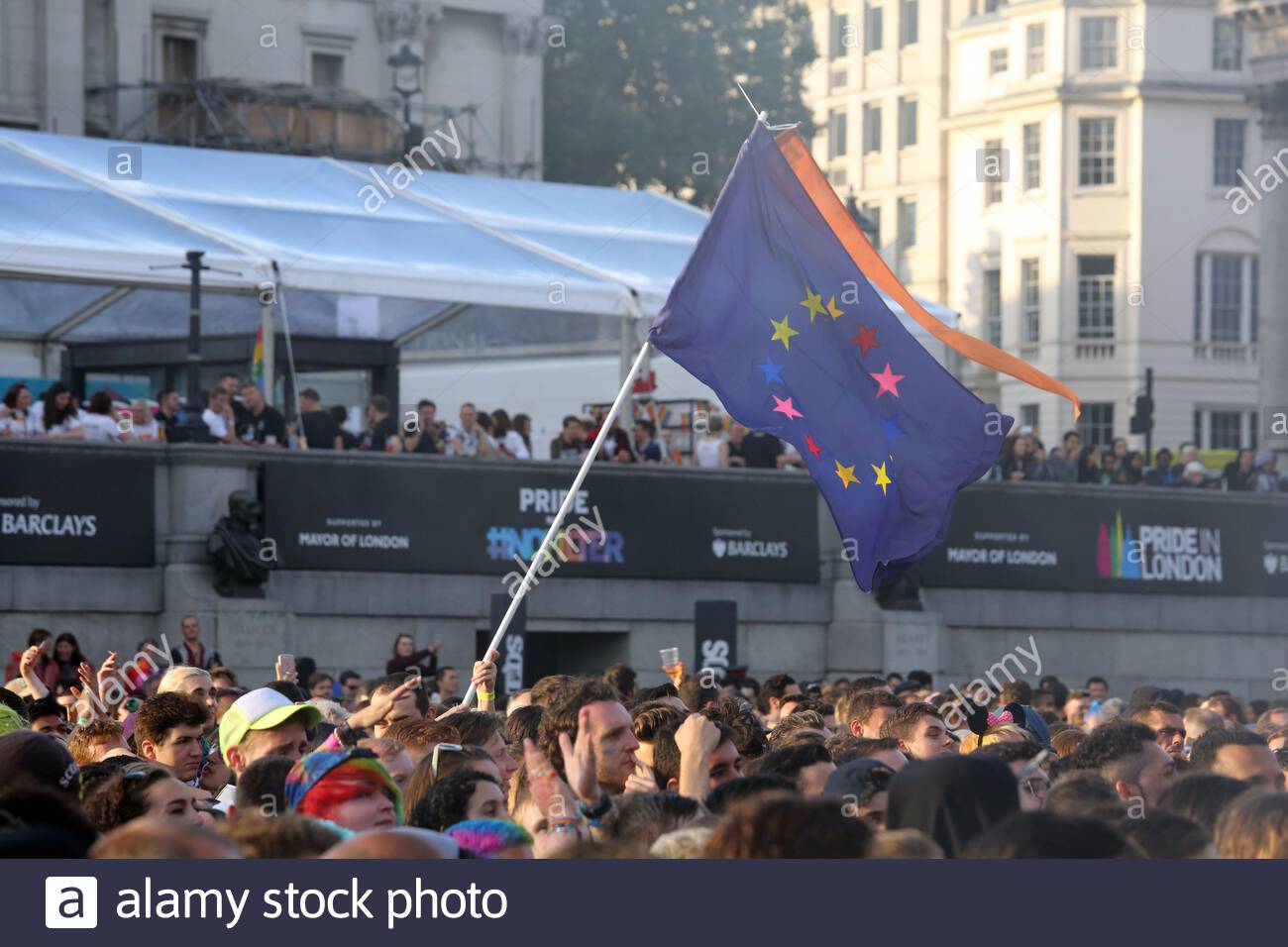 An EU flag high above the crowd in trafalgar Square as the Pride London ...