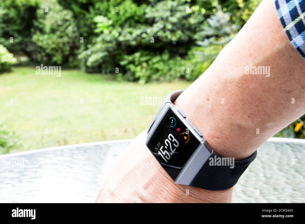 Closeup of hands and wrist with smart watch screen Stock Photo - Alamy