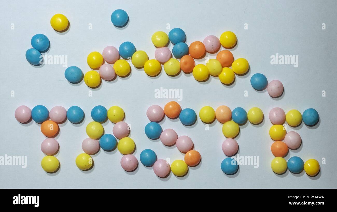 Colorful round candy name taste, sweet word on white background Stock ...