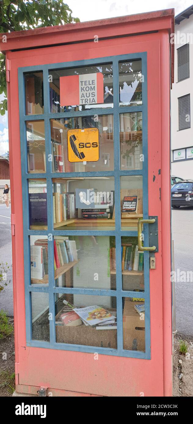 Old telephone booth that is now used as a mini library, where you can ...