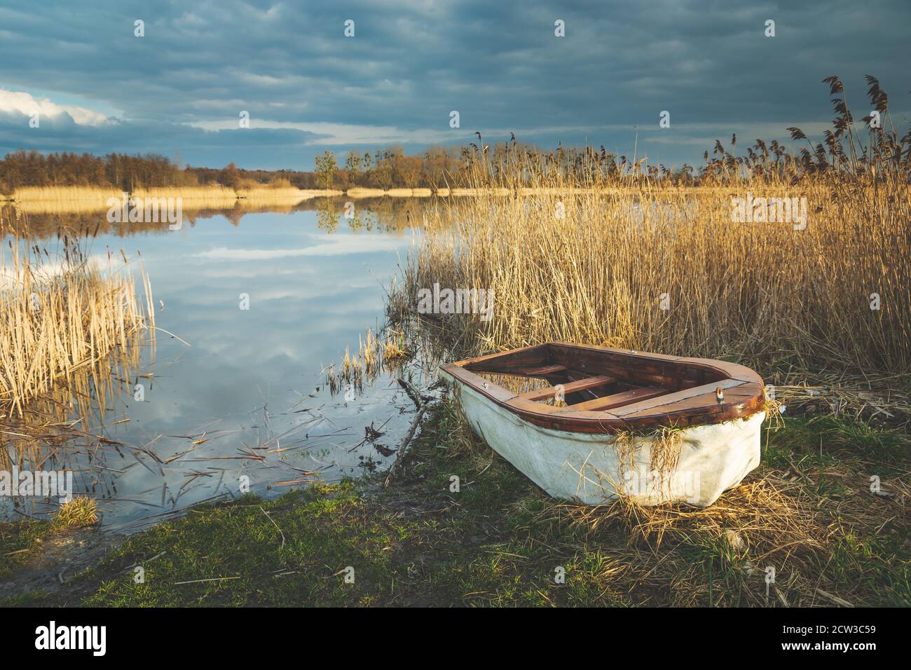 Empty wooden boat on lake hi-res stock photography and images - Alamy