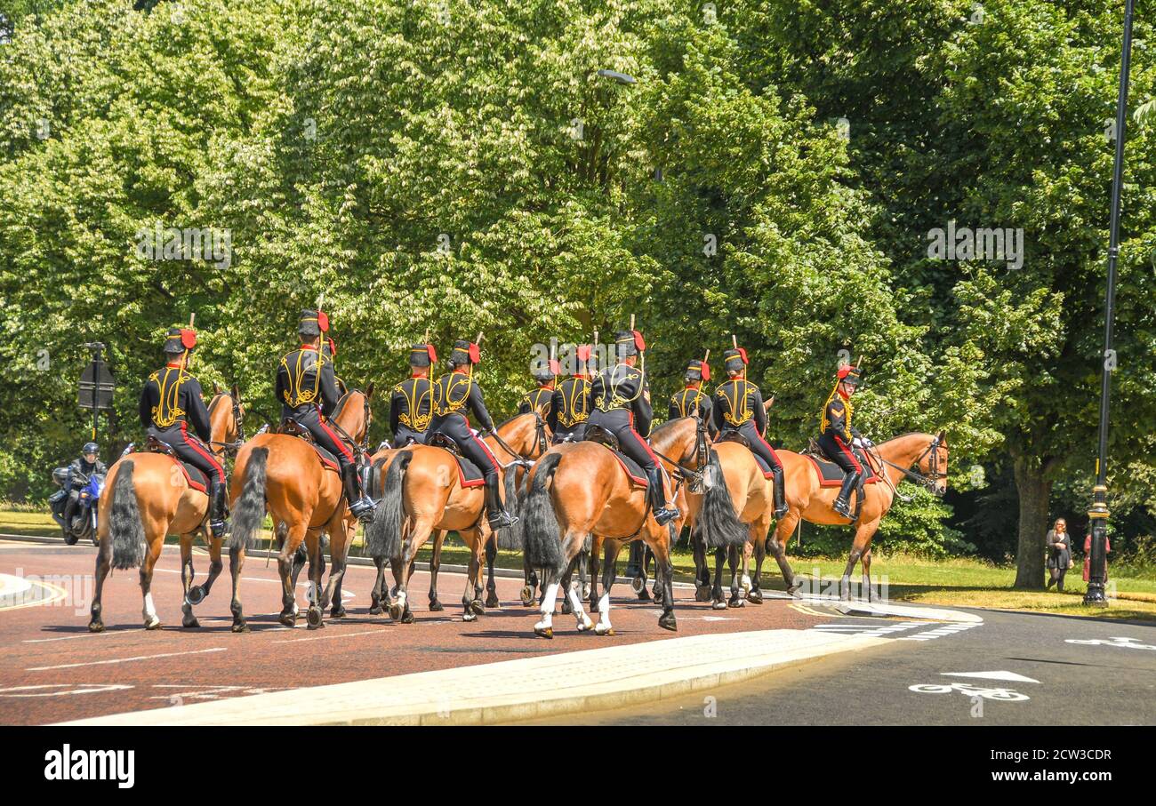 London, England - July 2018: Cavalry soldiers on horseback riding on a ...