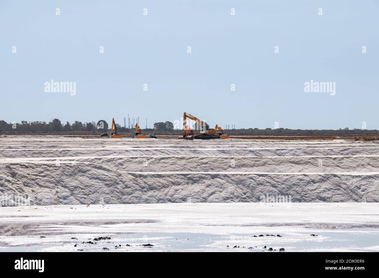 Sea salt piles ready for harvest in Marismas del Odiel wetlands. Sea ...