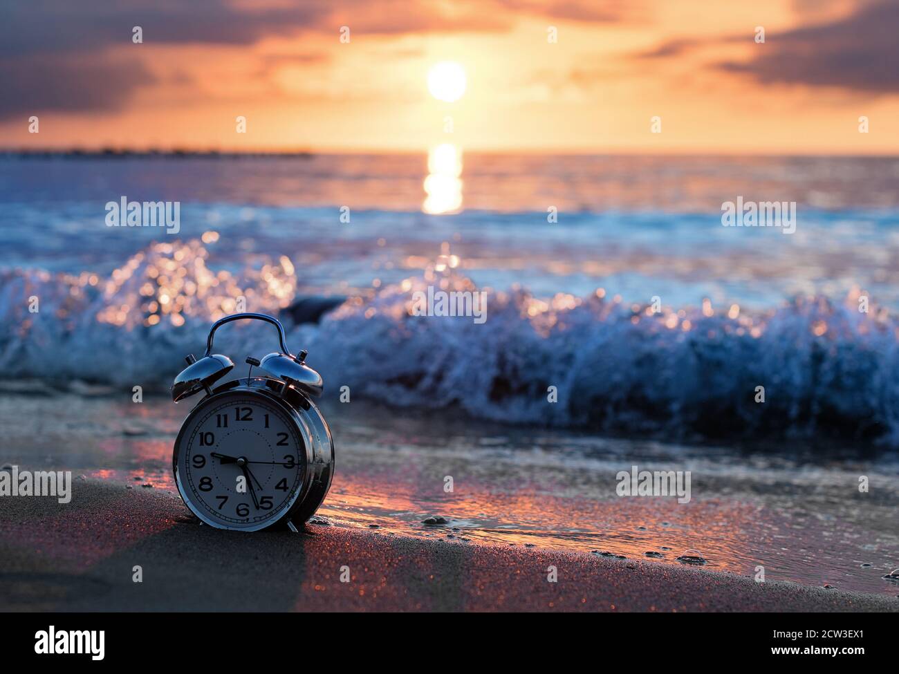 Clock on the beach hi-res stock photography and images - Alamy