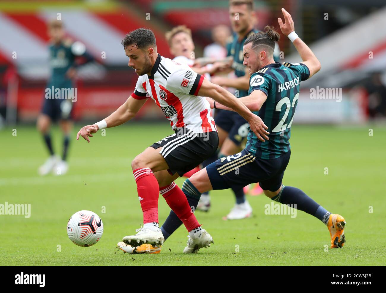 Sheffield United's George Baldock (left) and Leeds United's Jack ...