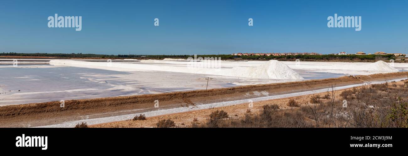 Sea salt pile ready for harvest in Marismas del Odiel wetlands. Sea ...