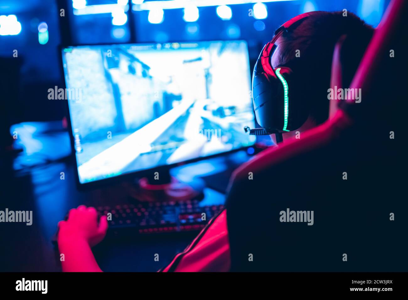 Professional gamer playing online games tournaments pc computer with ...