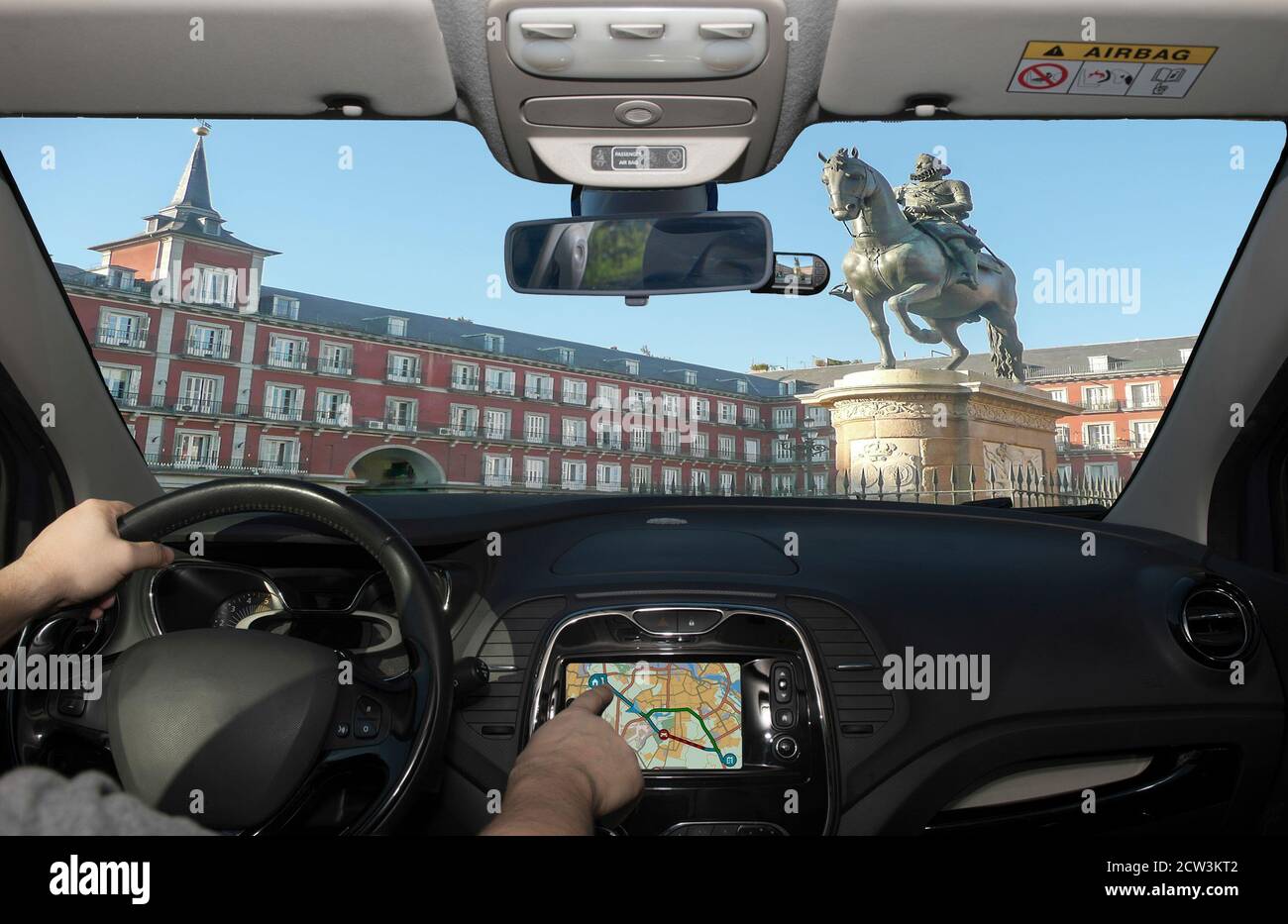 Driving a car while using the touch screen of a GPS navigation system ...