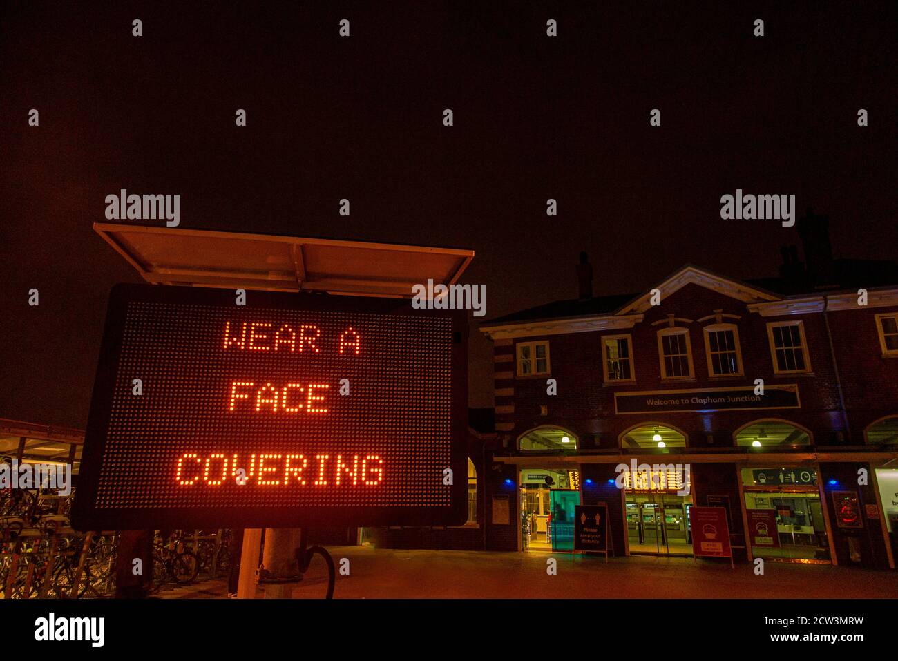 An electronic sign at Clapham Juntion station at night ordering the ...