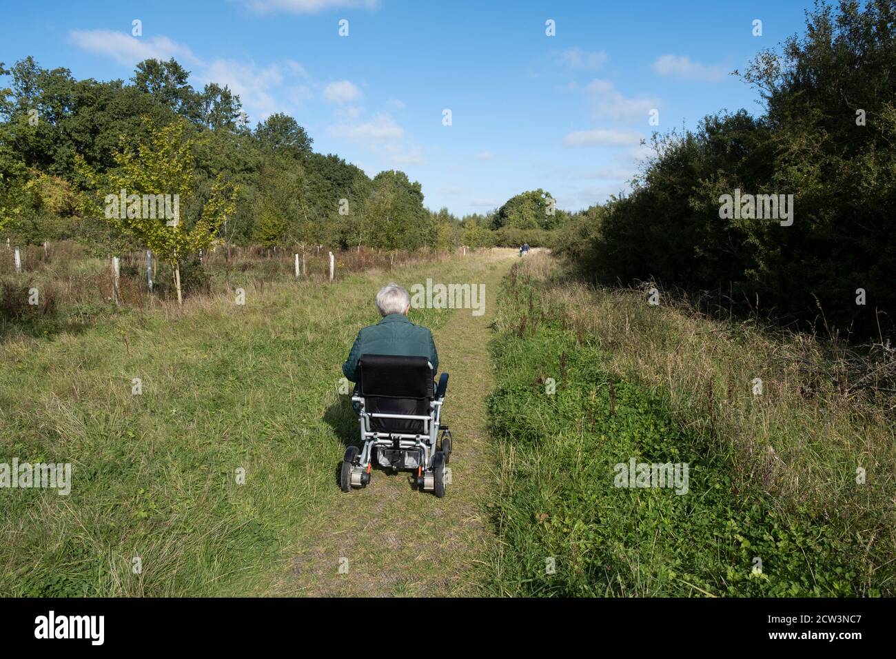 A lady using an electric wheelchair on specially built accessible ...