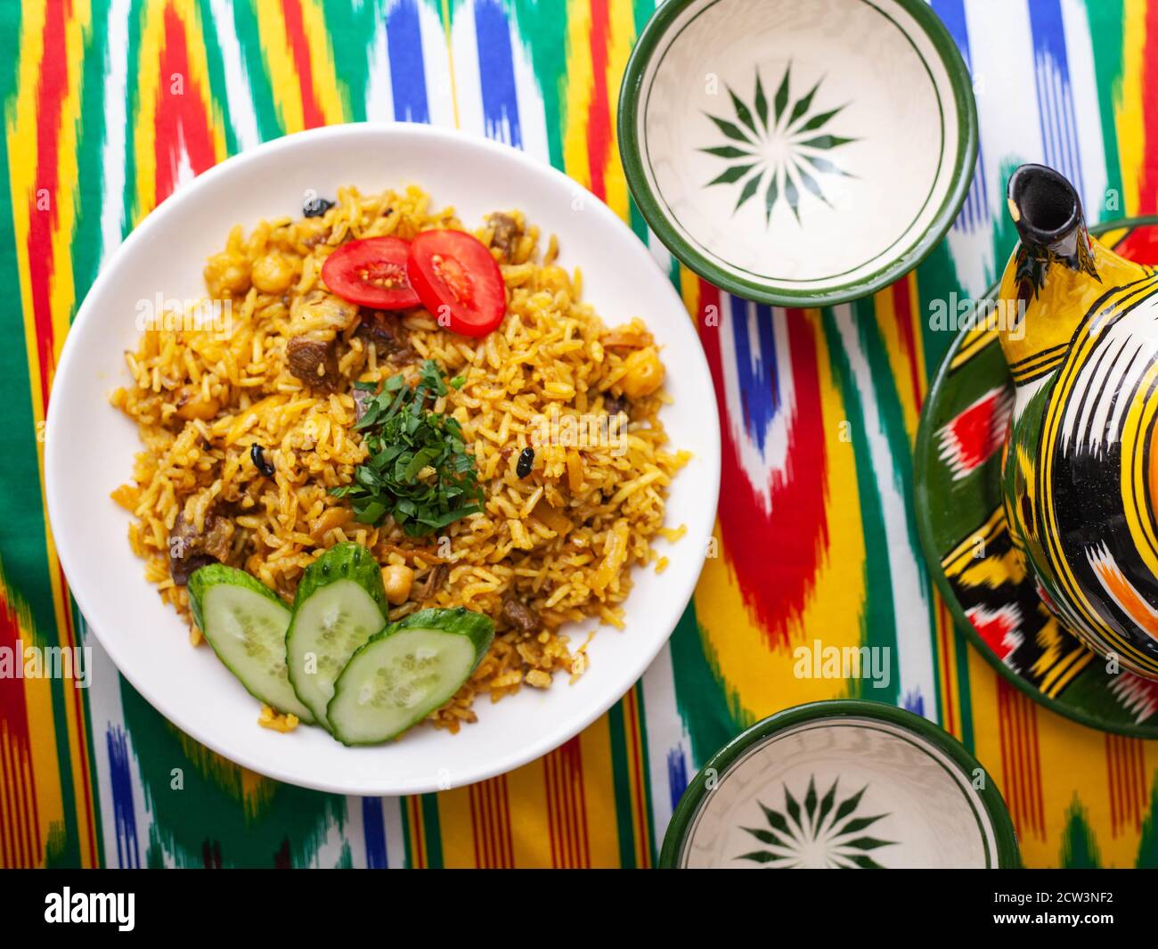 National Uzbek pilaf with meat on the table in the Uzbek style.on a ...