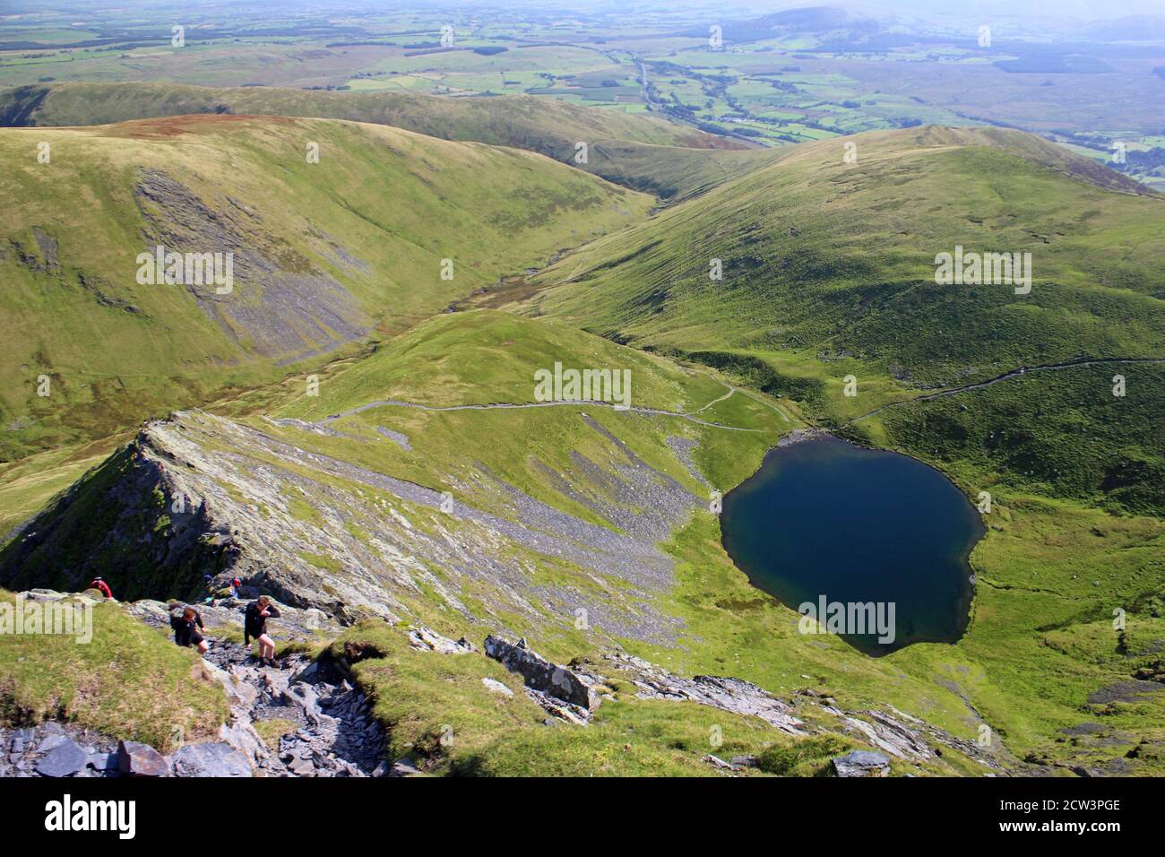 Walkers on the ridge Sharp edge on Blencathra Stock Photo - Alamy
