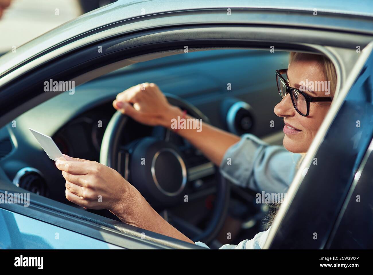 Girl behind steering wheel hi-res stock photography and images - Alamy