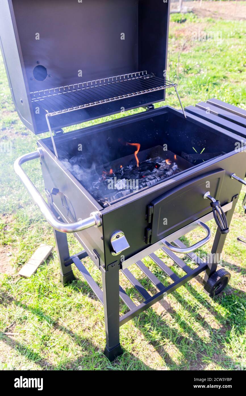 open grill bbq with hot charcoal ready for cooking meat and vegetables ...