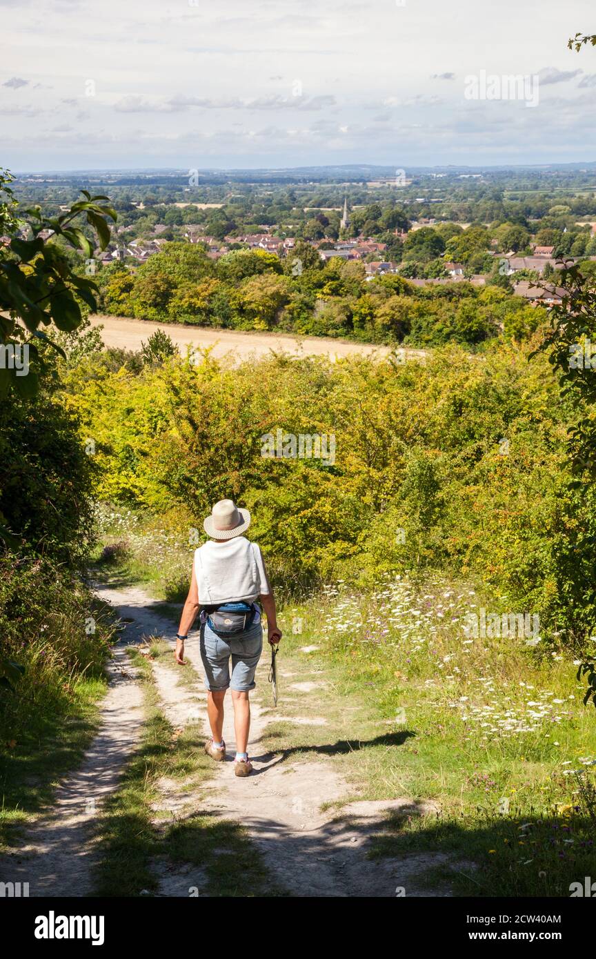 Woman walking on the Ridgeway long distance footpath trail in the ...