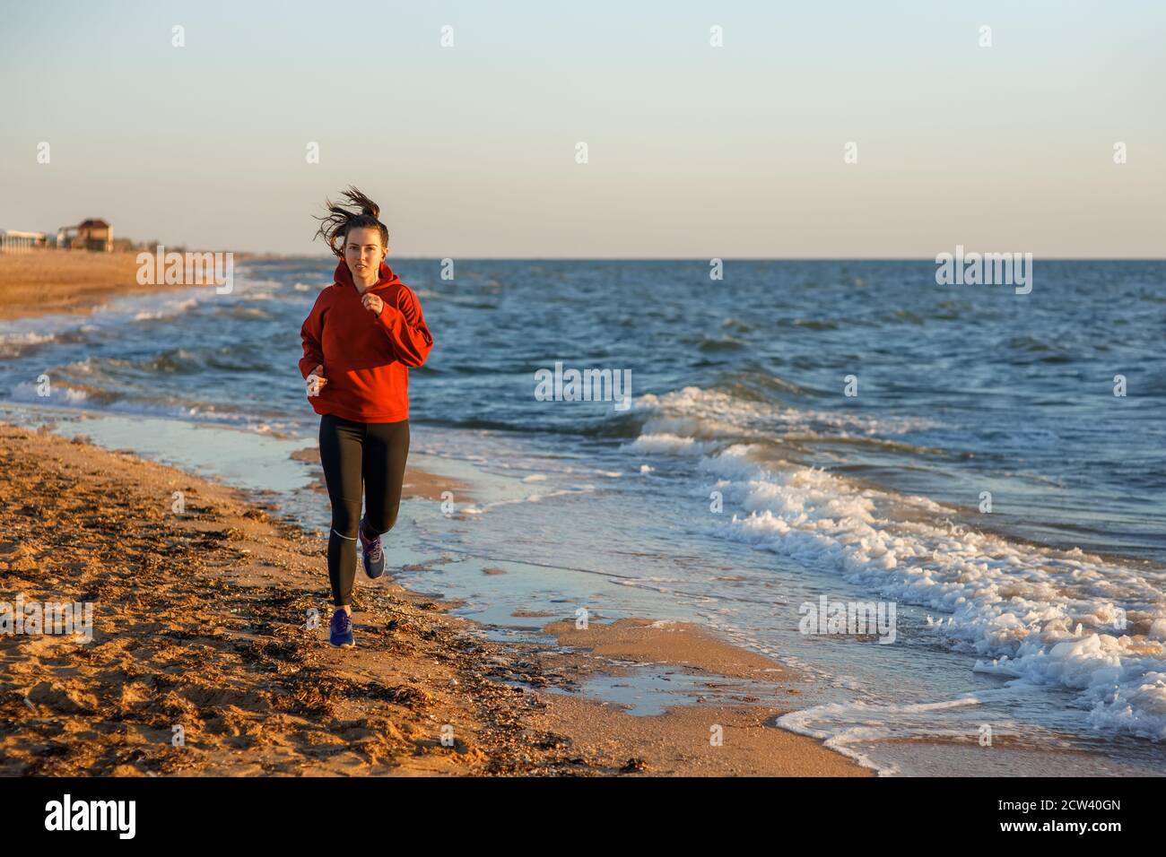 Woman jog beach hi-res stock photography and images - Alamy