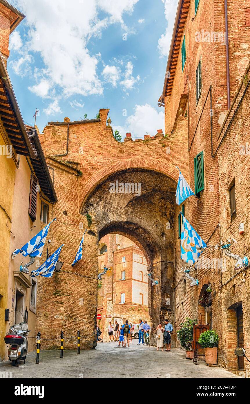 SIENA, ITALY - JUNE 22: Walking in the picturesque streets in the ...