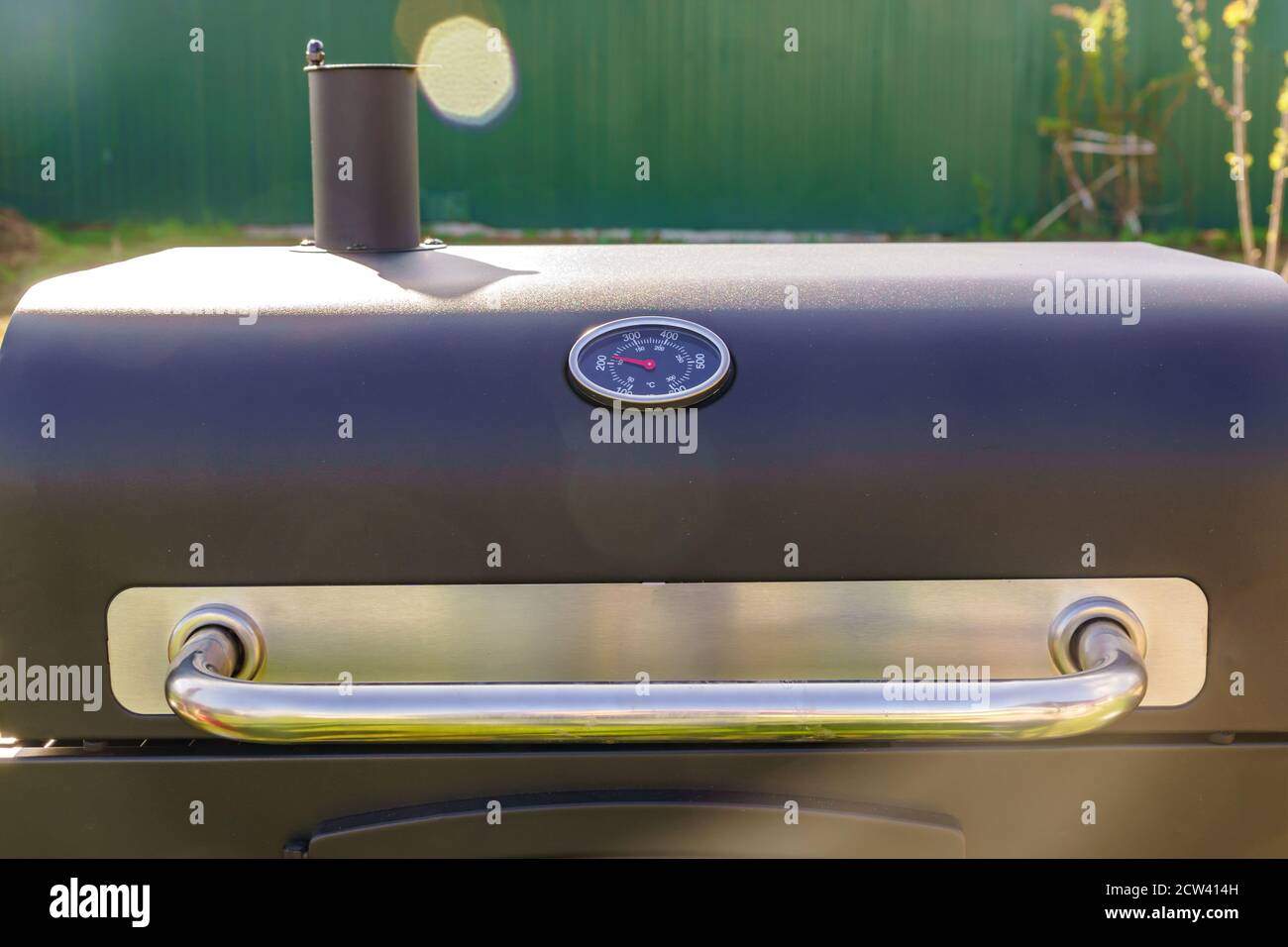 Closed bbq grill with the thermometer showing the temperature standing ...