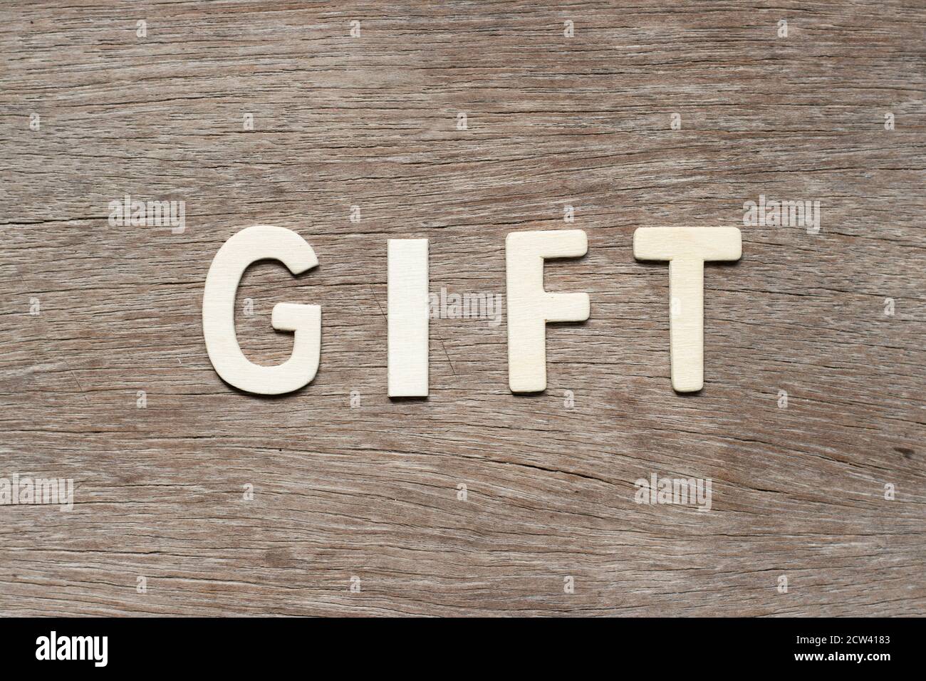 Alphabet letter in word gift on wood background Stock Photo - Alamy