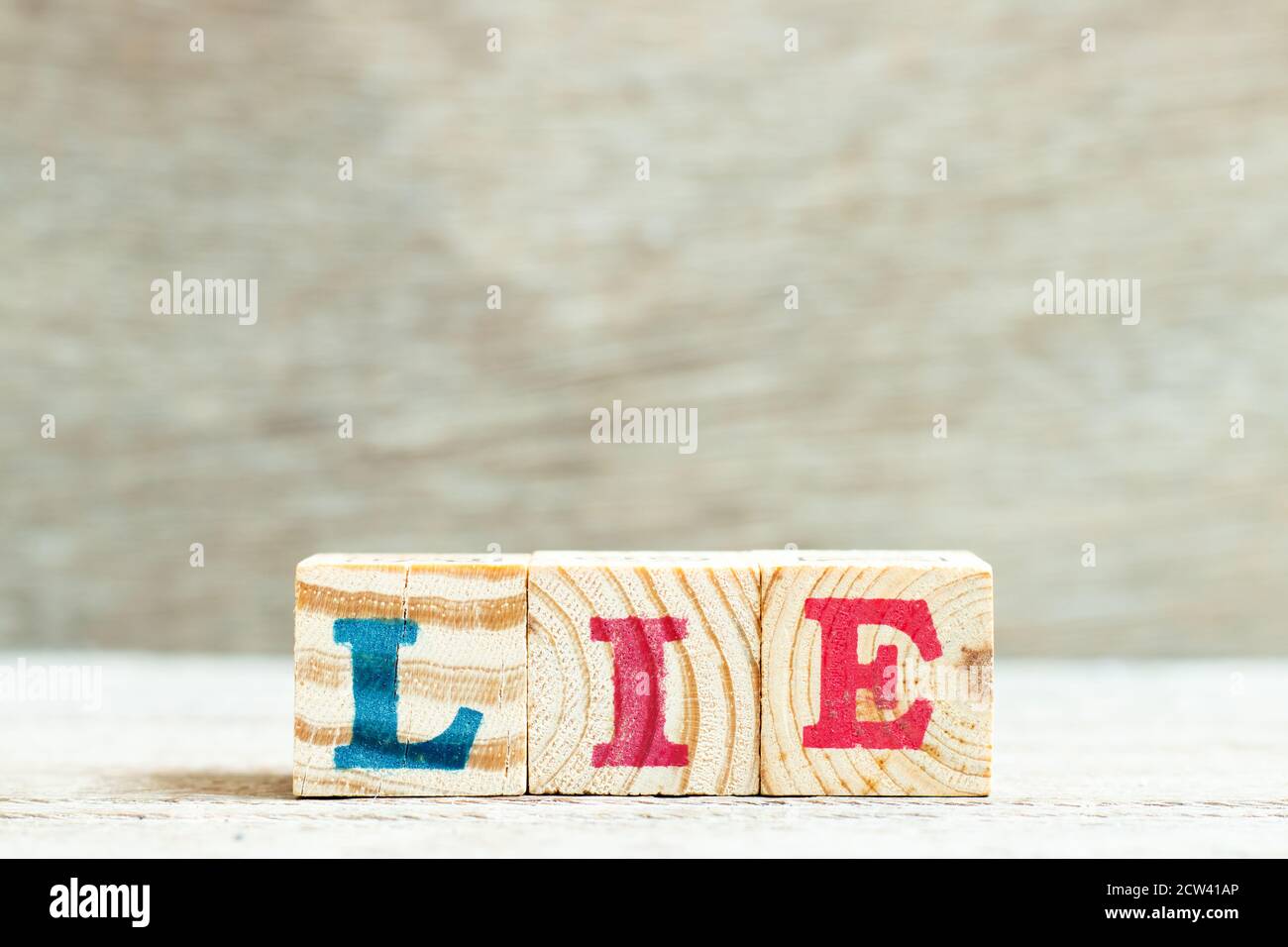 Alphabet letter in word lie on wood background Stock Photo - Alamy