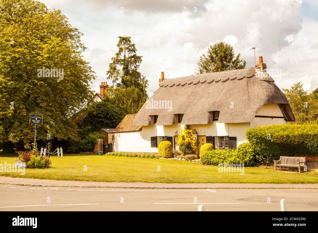 Thatched cottages on the village green in the Buckinghamshire village ...