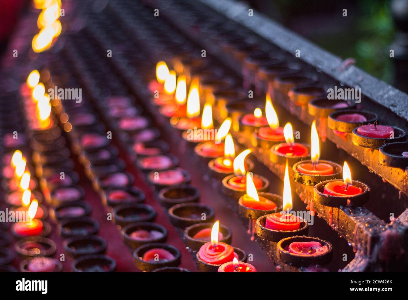 Lighted candles at the Basilica del Sto Nino in Cebu Stock Photo - Alamy