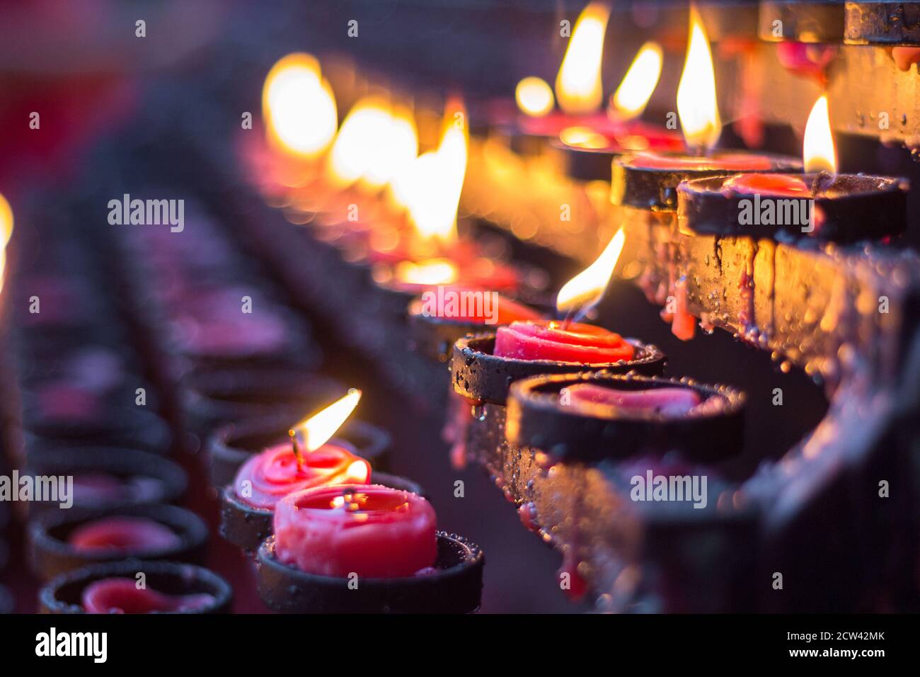 Lighted candles at the Basilica del Sto Nino in Cebu Stock Photo - Alamy
