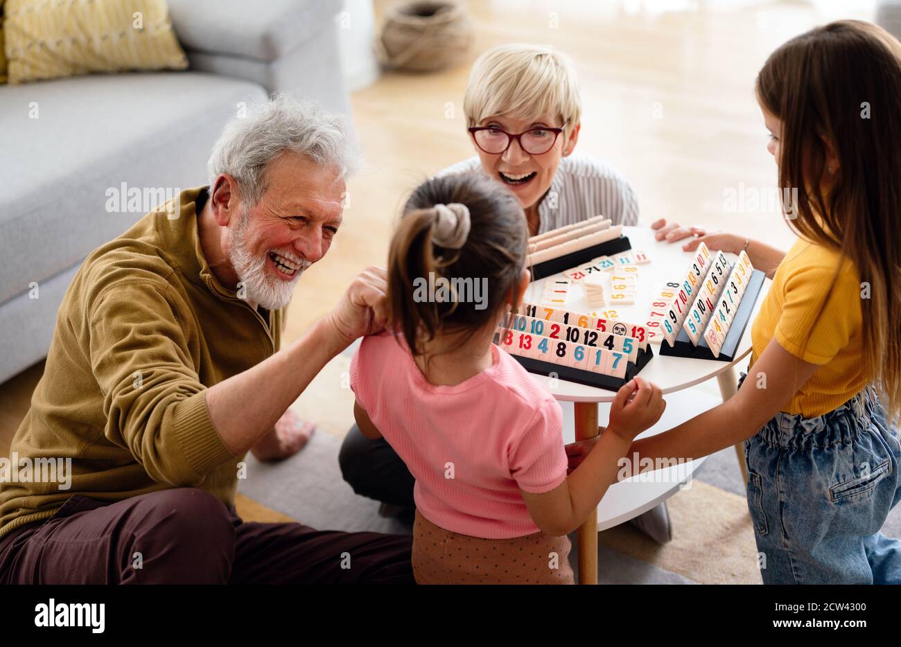 Grandparents and grandchildren playing hi-res stock photography and ...