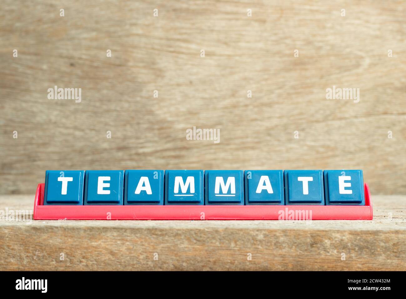 Tile letter on red rack in word teammate on wood background Stock Photo ...