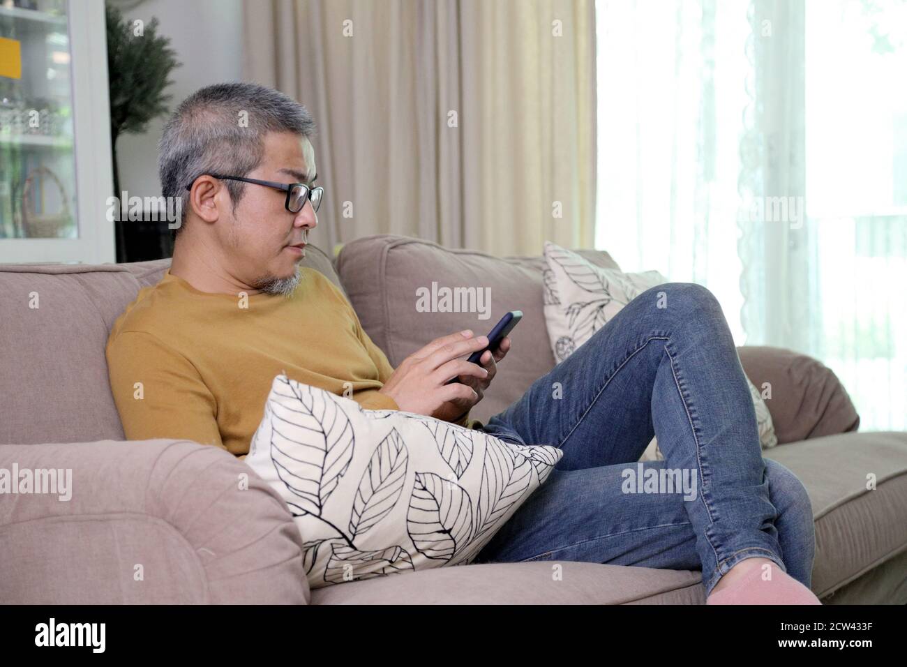 Asian man relaxing hi-res stock photography and images - Alamy