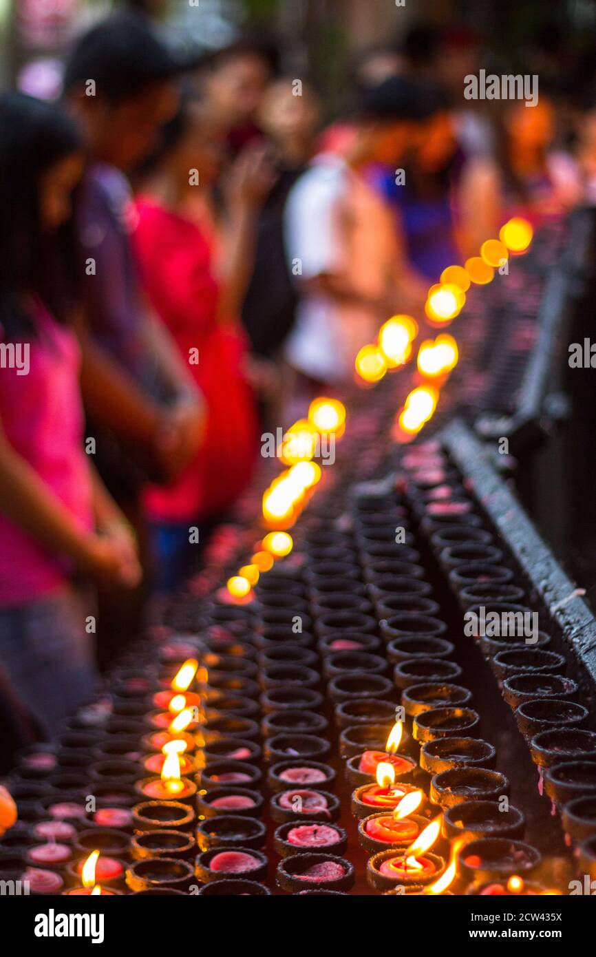 Lighted candles at the Basilica del Sto Nino in Cebu Stock Photo - Alamy