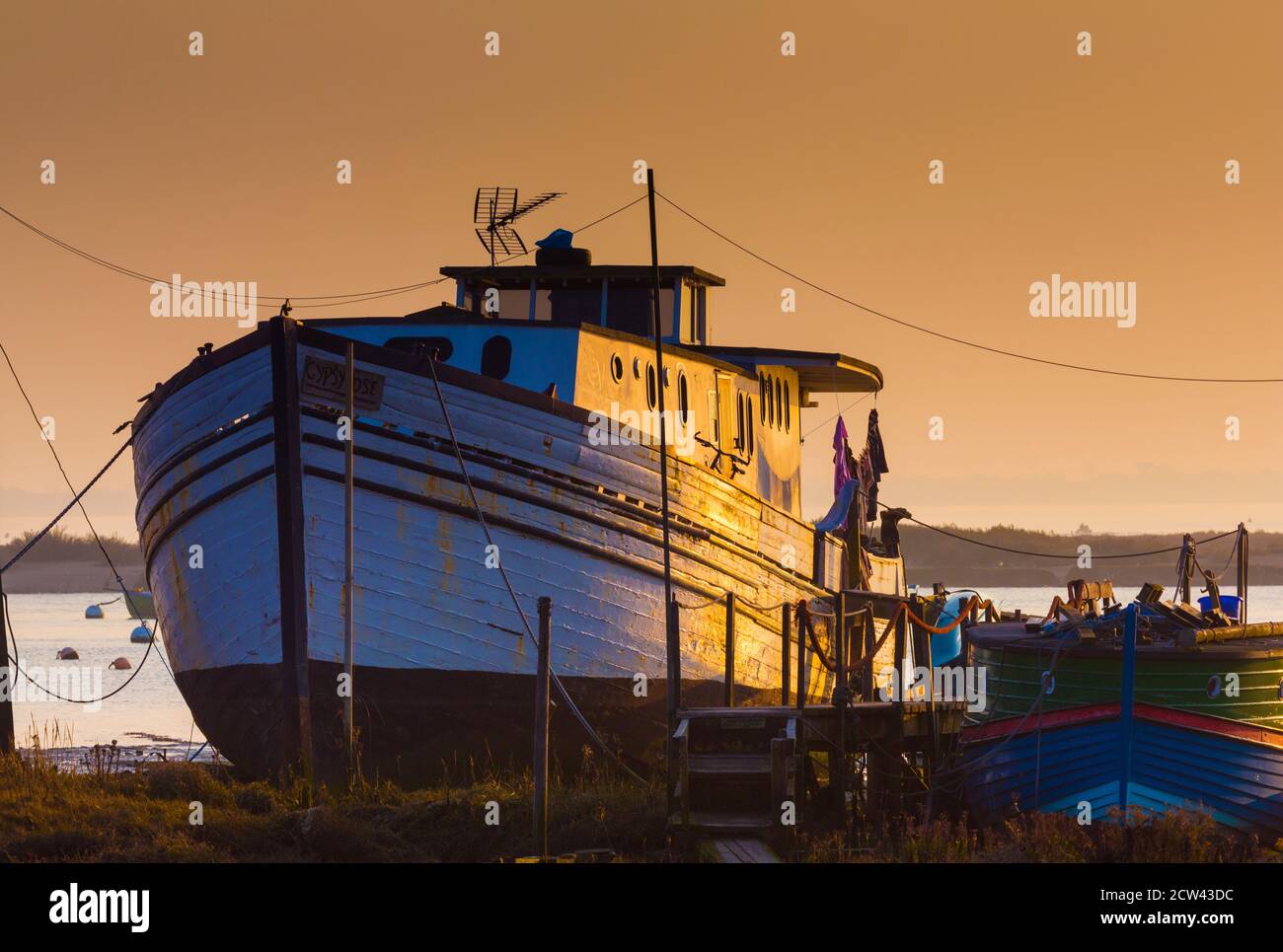 Boats on the coast of West Mersea, Essex, UK Stock Photo - Alamy