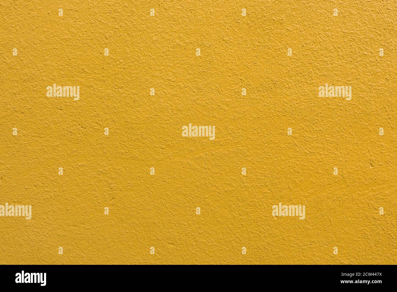 Concrete wall yellow color for texture background Stock Photo - Alamy