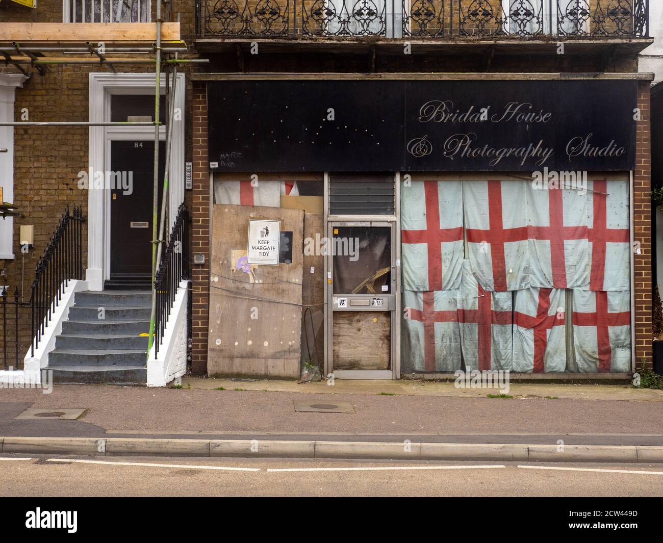 England flags in the window of a disused high street photograpahy ...