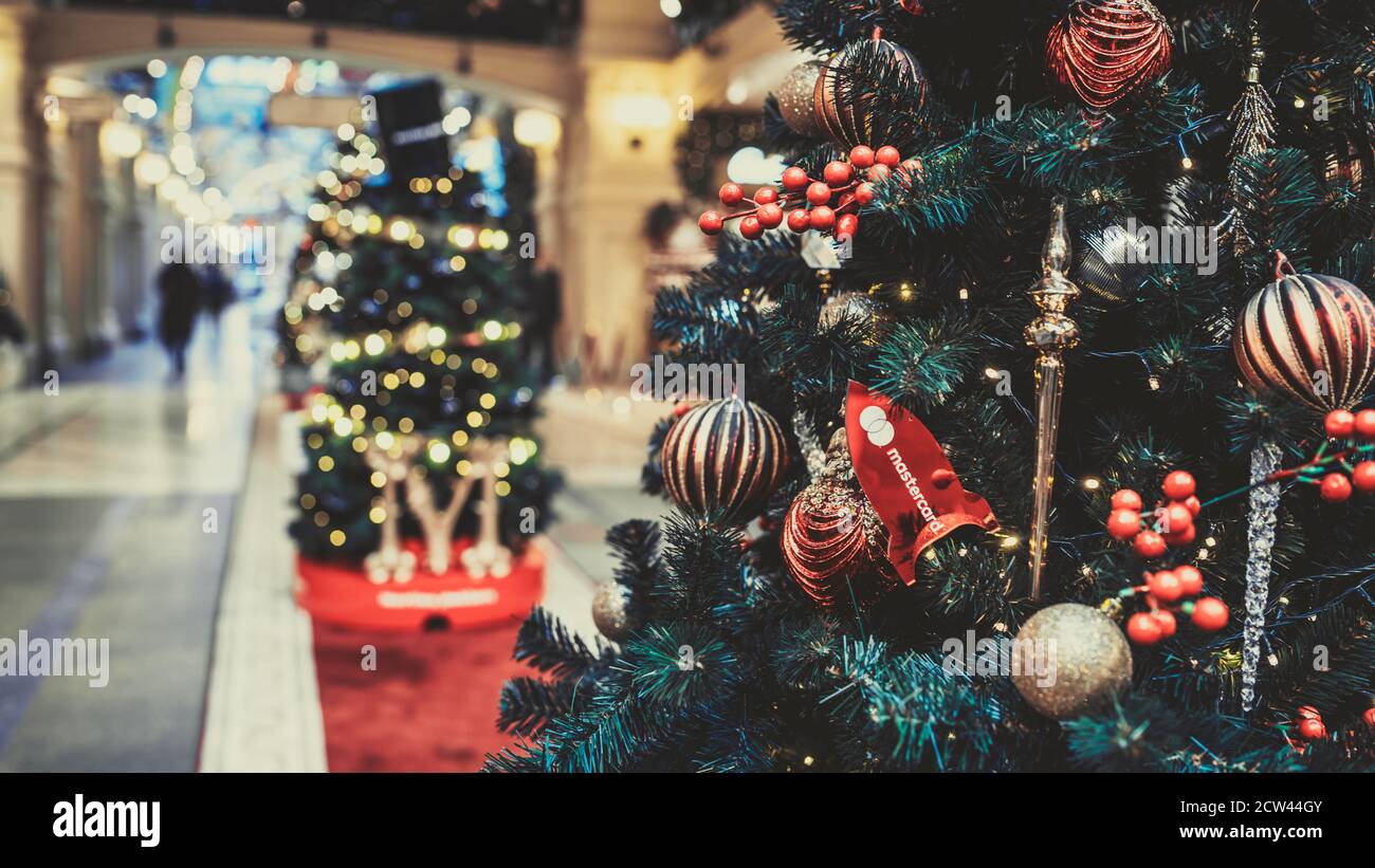 Close up of part of Christmas tree with different christmas toys and ...
