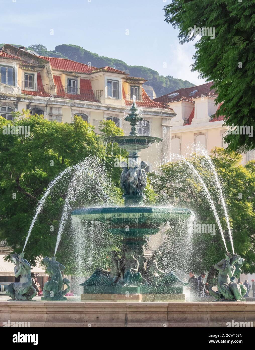 Baroque fountain with mythological figures in the central Rossio square ...