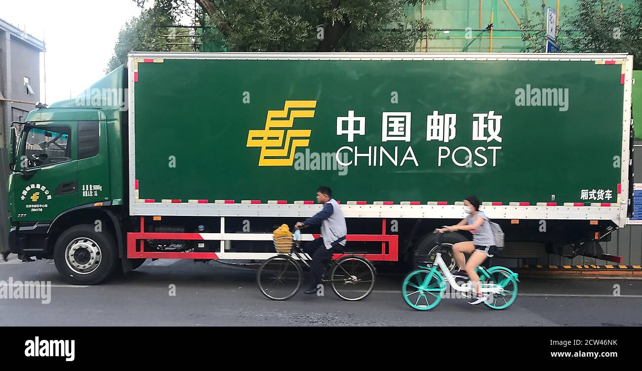 Beijing, China. 27th Sep, 2020. A China Post truck is parked outside a ...