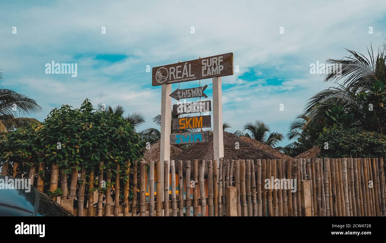 Iconic sign board of Real coast and surf resort Stock Photo - Alamy