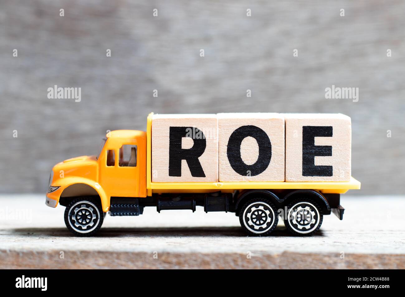 Truck hold letter block in word ROE (Abbbreviation of Return on equity ...